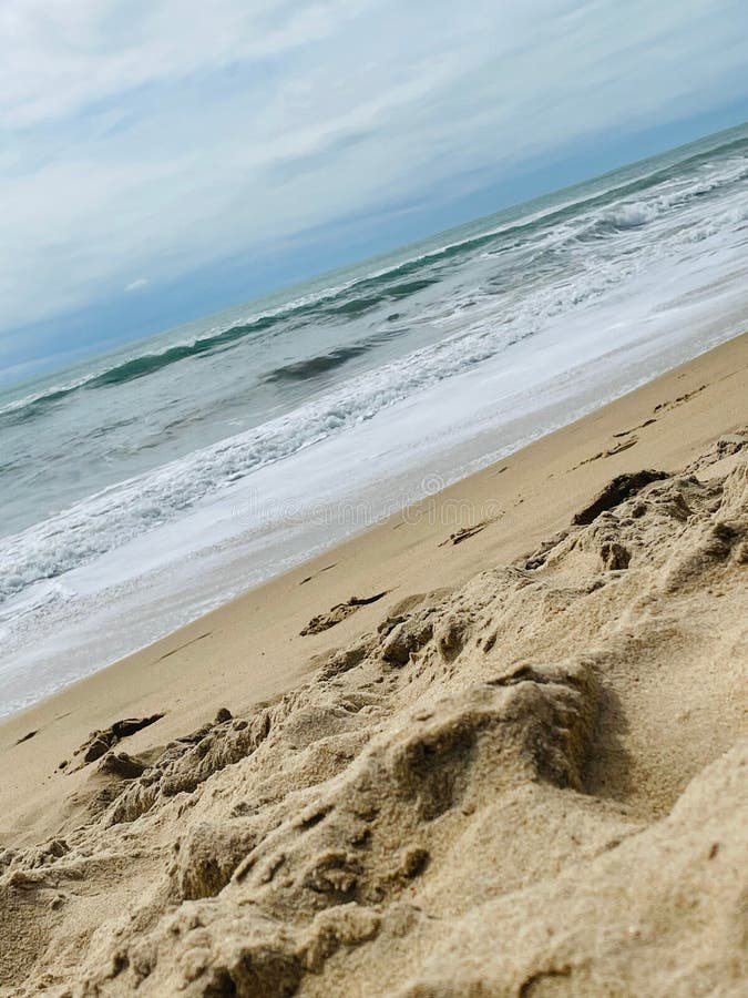 Picturesque Beach with a Sandy Shore, Clear Waters and Gentle Waves ...