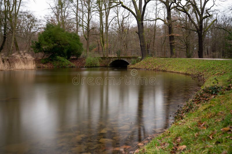 Picturesque Bridge with an Arched Structure Spanning a Tranquil River ...