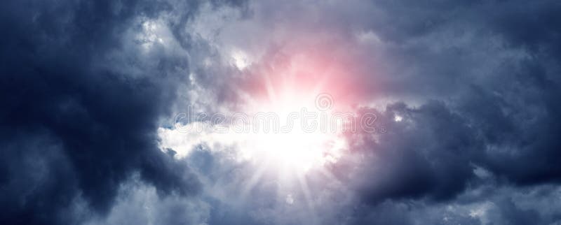 A Picturesque Dark Stormy Sky with Dense Clouds through Which the Sun ...