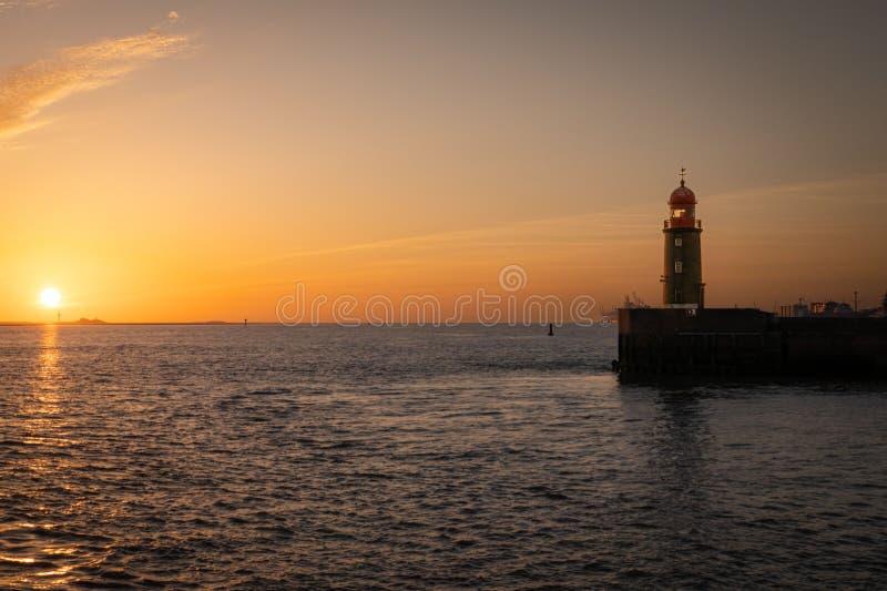 Picturesque Lighthouse Illuminated by the Setting Sun, Which Casts a ...