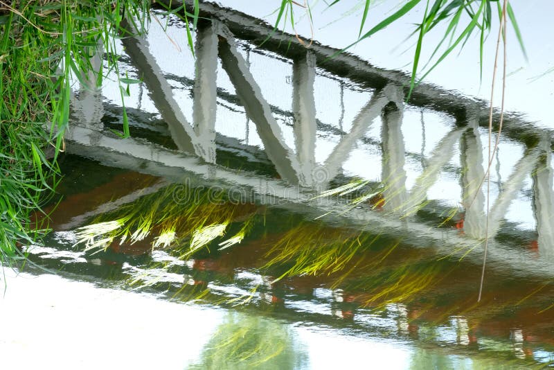 Picturesque Reflection of a Bridge in Vibrating Water Surface. Stock ...