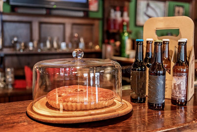 Pie and Bottles of Beer Locating on Bar Stock Image - Image of ...