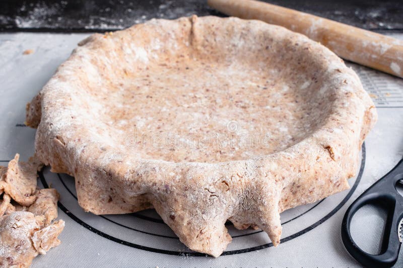 Rolled Out Pecan Shortbread Pie Crust Draped Over a Pie Pan Angled View ...