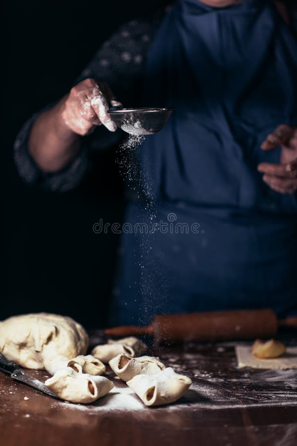 Pie on Dark with Hand. Concept of Decorating Bakery Stock Image - Image ...