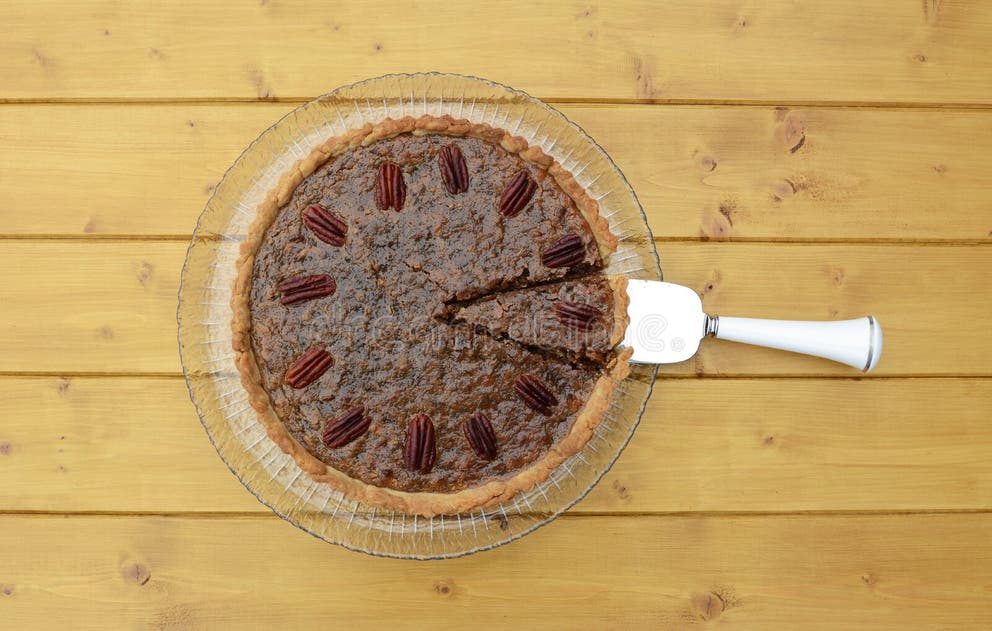 Pie Server with Cut Slice in a Traditional Pecan Pie Stock Photo ...