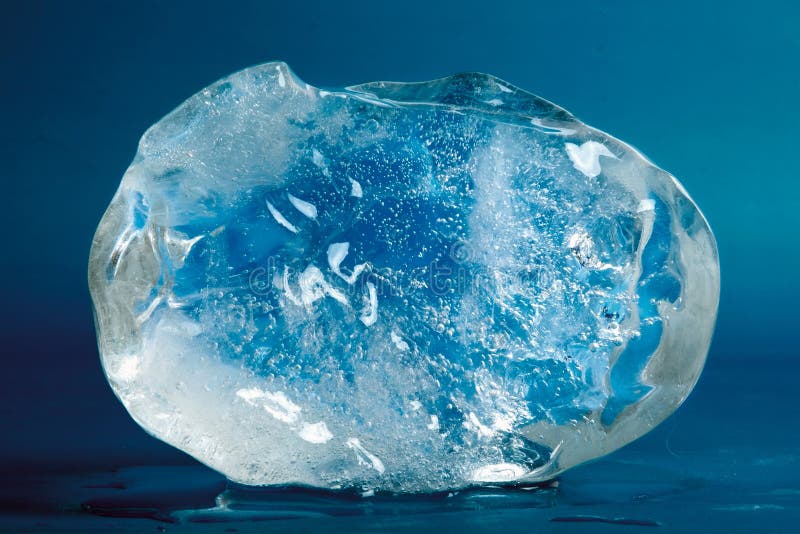 A Piece of Shape of Ice on a Blue Background Stock Photo - Image of ...