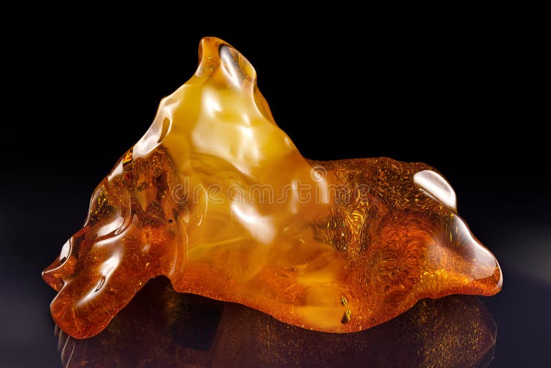 A Piece Amber on a Black Background Stock Image - Image of crystal ...