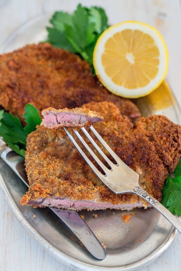 Piece of Beef Schnitzel on a Fork. Stock Photo - Image of sirloin ...
