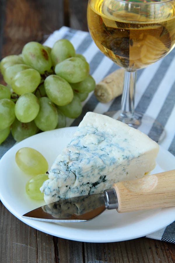 Piece of Blue Cheese, Grapes and Knife Stock Photo - Image of ...