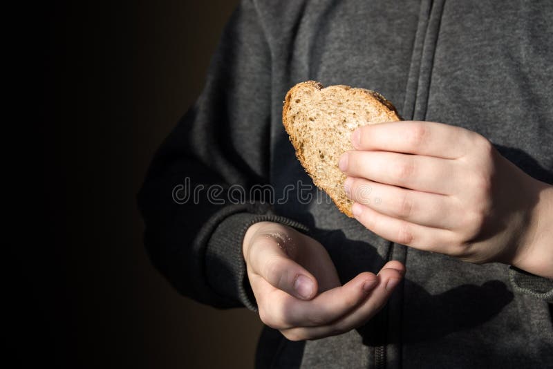 Piece of bread in hands stock photo. Image of bread, eating - 66329930