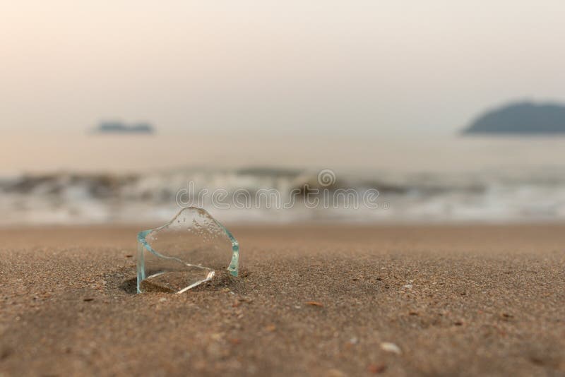 Piece of Broken Glass on the Sand Beach Stock Image - Image of light ...