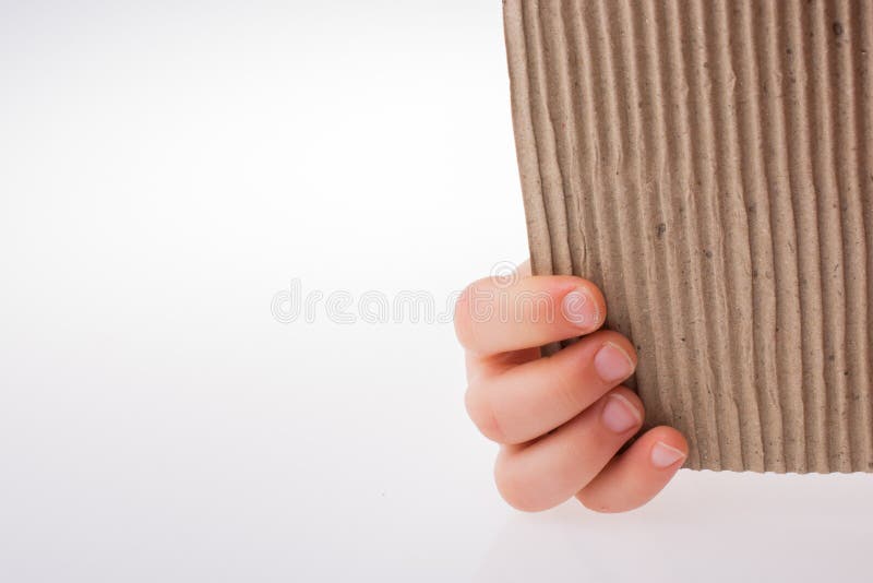 Piece of Brown Color Cardboard in Hand Stock Photo - Image of card ...