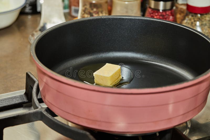 Piece of Butter is Melted in Pan before Cooking Stock Image - Image of ...