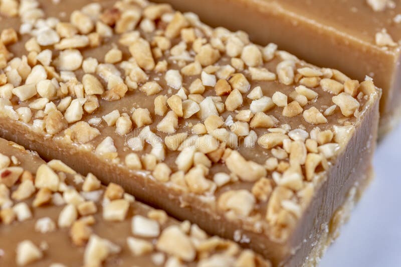 A Piece of Caramel Slice Covered with Nuts Stock Image - Image of ...