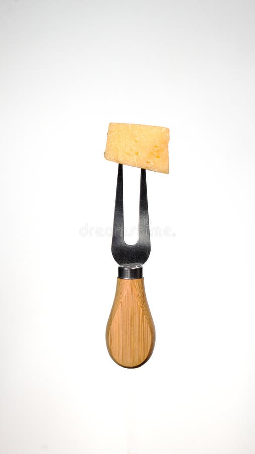 A Piece of Hard Cheese for a Snack on a Fork Stock Image - Image of ...