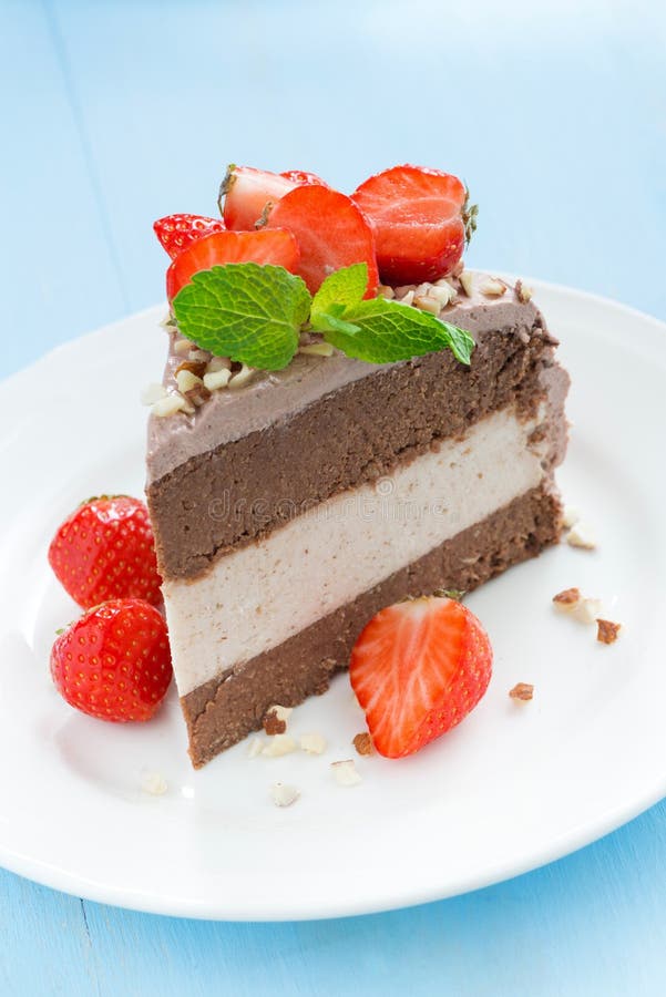 Piece of Chocolate Cake of Three Layers on Plate, Vertical Stock Photo ...
