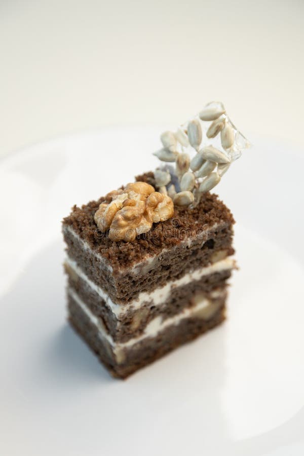 A Piece of Chocolate Cake with a Walnut Close-up. Sliced Cake, Side ...