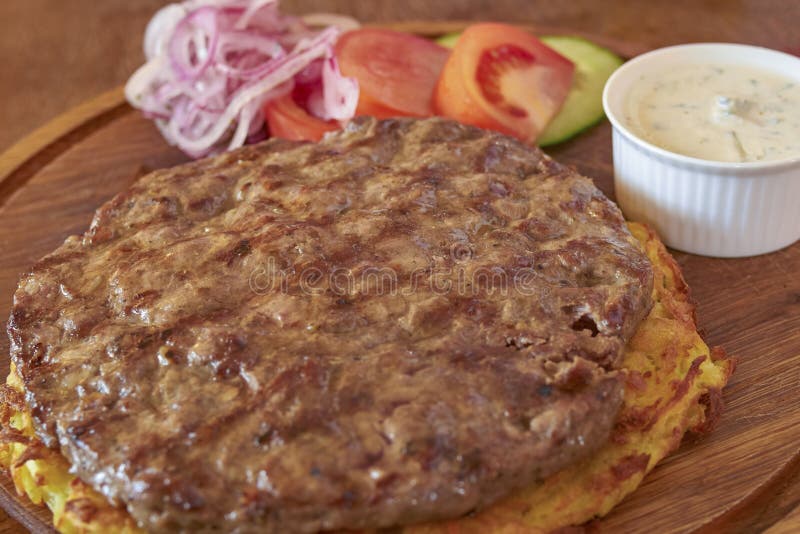 A Piece of Delicious Grilled Meat on a Burger, Close-up Stock Photo ...
