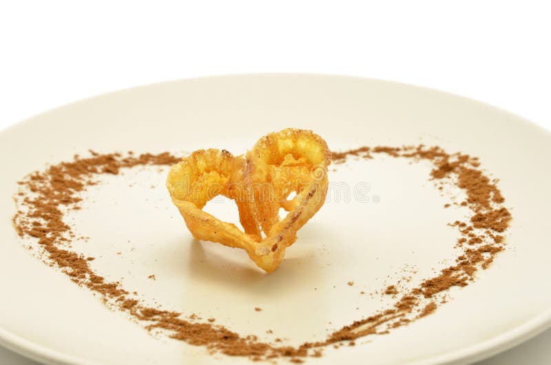 Piece of Fried Flower Decorated with Heart-shaped Cinnamon Stock Photo ...