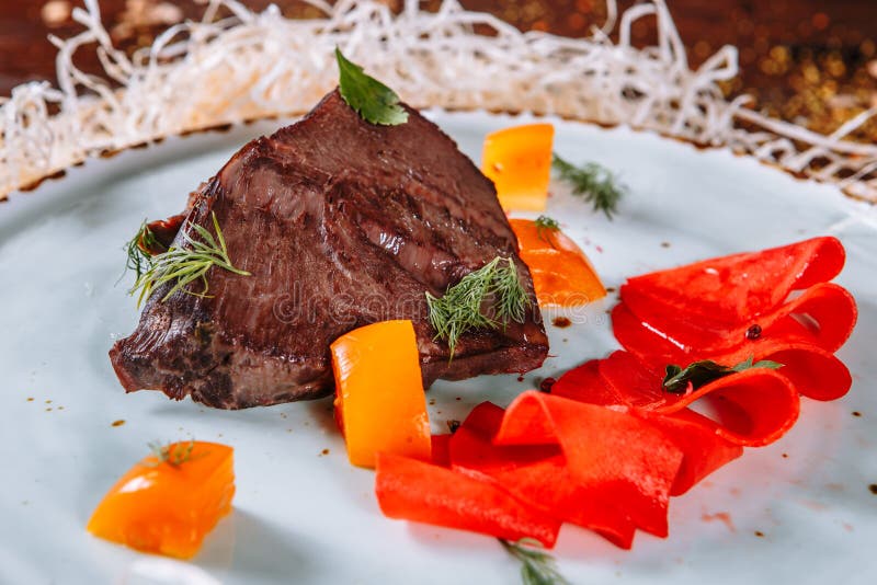 A Piece of Fried Meat with Finely Chopped Vegetables Stock Photo ...