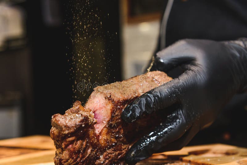 A Piece of Fried Meat in the Hands Stock Photo - Image of background ...