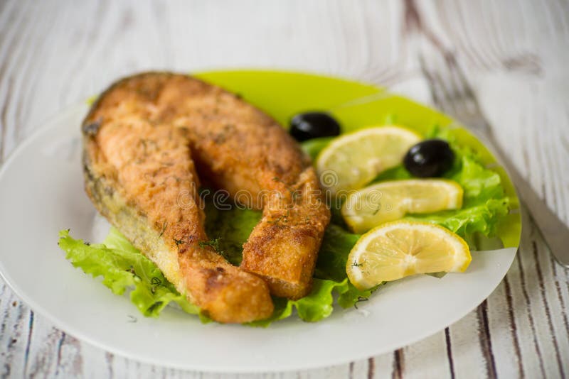 Piece of Fried Salmon Fish in a Plate with Lemon Stock Photo - Image of ...