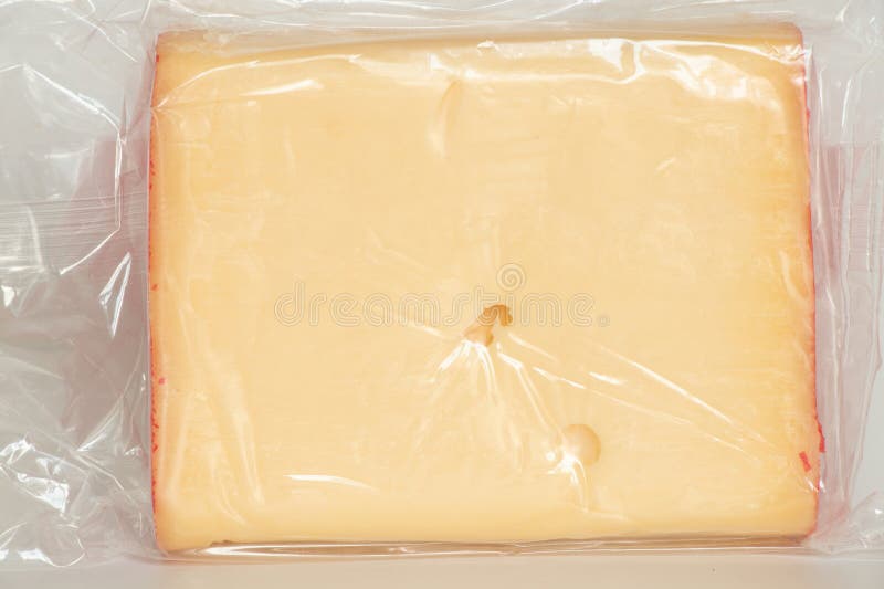 Piece of Hard Cheese in Packaging on White Background , Packaged Cheese ...