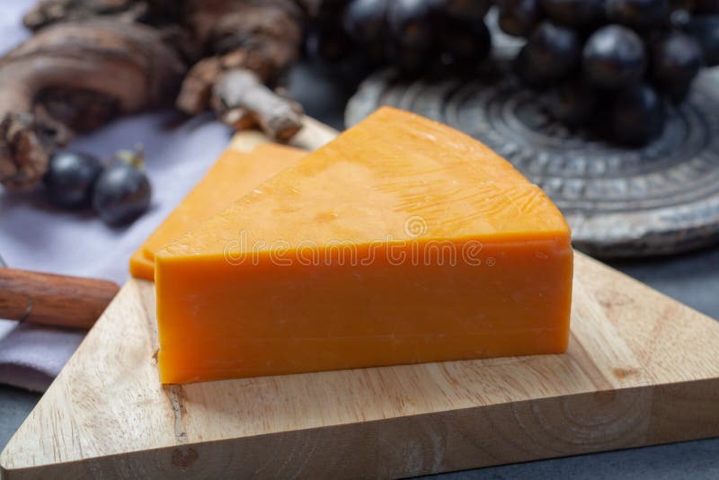 Piece of Hard Orange Cheddar Cheese Close Up Stock Photo - Image of ...