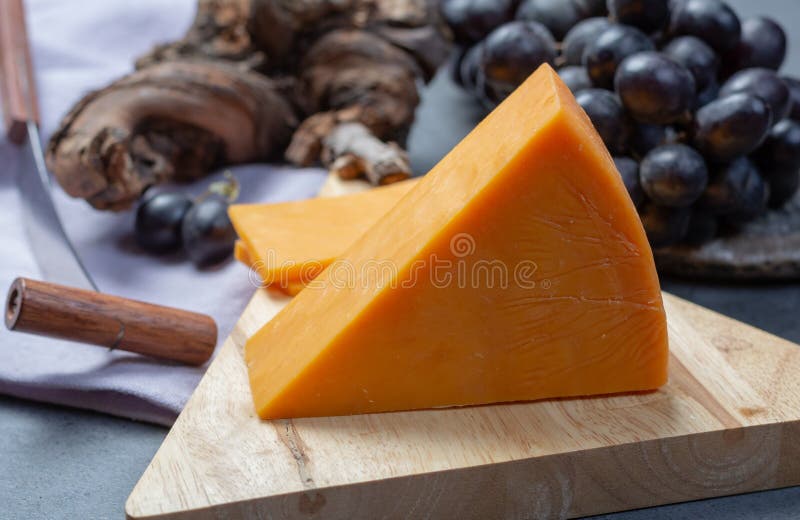 Piece of Hard Orange Cheddar Cheese Close Up Stock Image - Image of ...