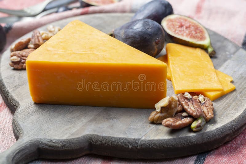 Piece of Hard Orange Cheddar Cheese Close Up Stock Image - Image of ...