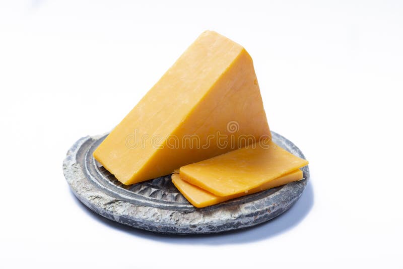Piece of Hard Orange Cheddar Cheese on Grey Stone Plate Isolated Close ...
