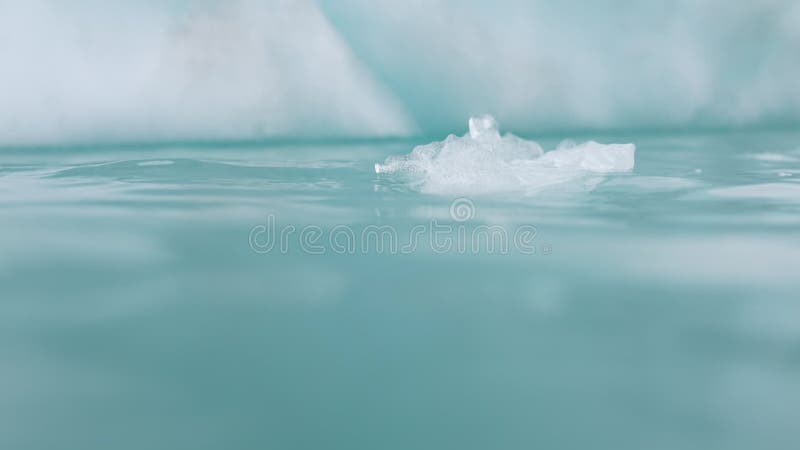 Piece of Ice Floating in Cold Arctic Sea Under Glacier, Surface and ...