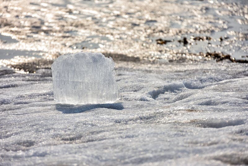 Piece of Ice in Snow by Lake, Ice in Snow, Piece of Ice Closeup Stock ...