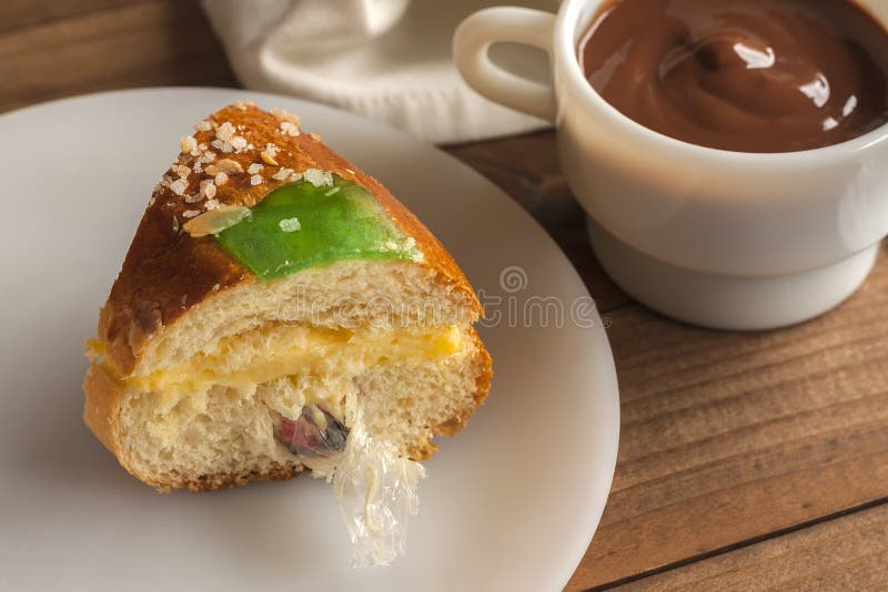 Piece of Kings Cake Roscon De Reyes with Surprise Stock Photo - Image ...