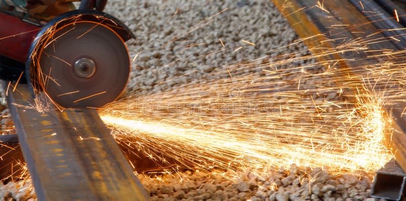 A Piece of Machinery is Cutting through a Metal Bar Stock Image - Image ...