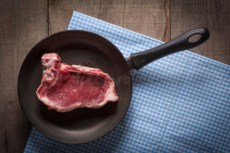 Piece of meat in pan stock photo. Image of steak, meat - 55065558