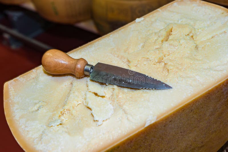 A Piece of Parmesan Cheese with Special Cheese Knife Stock Photo ...