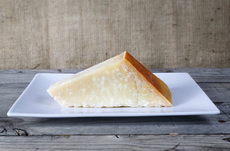Piece parmesan cheese stock photo. Image of dairy, plate - 40026758