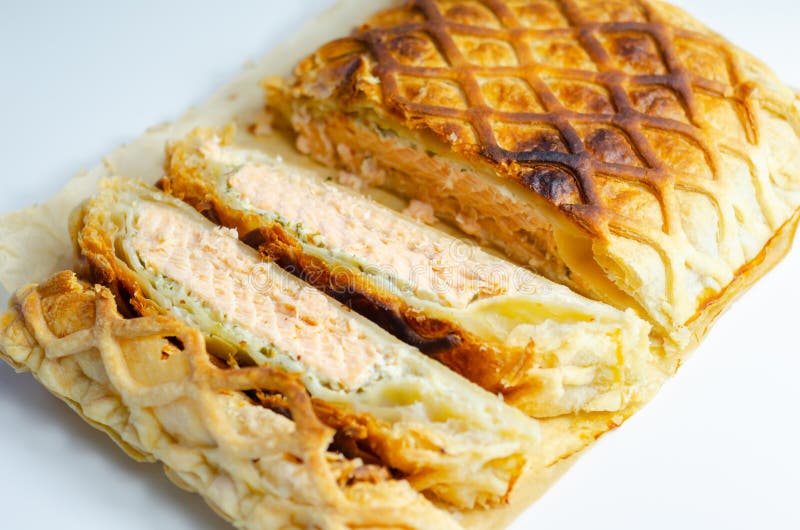 A Piece of Pastry with a Salmon in it is Cut Stock Image - Image of ...