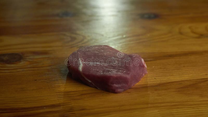 Piece of Pork or Beef Meat Preparing on a Table in Stop Motion Stock ...