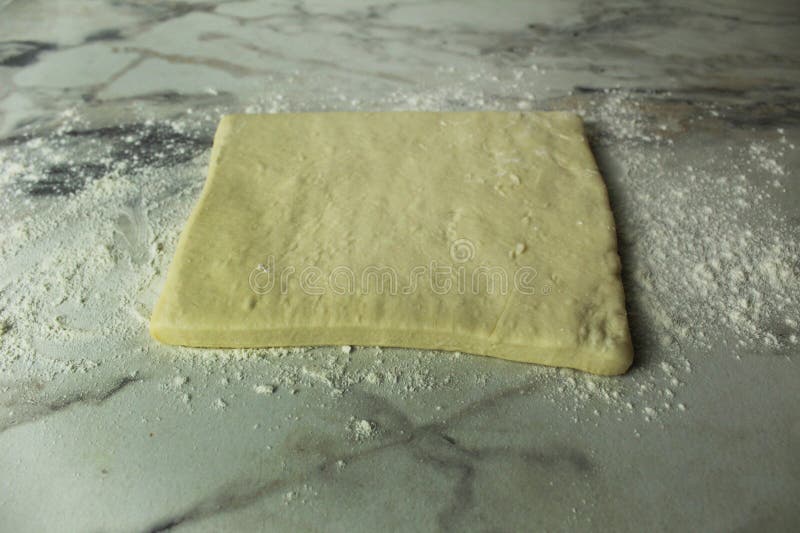 Piece of Raw Puff Pastry on the Table Side View Stock Photo - Image of ...