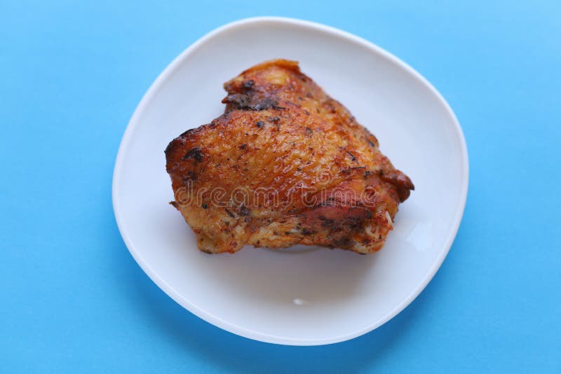A Piece of Roasted and Fried Chicken on a Plate Stock Photo - Image of ...