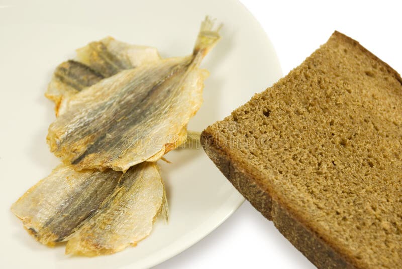 Piece of Rye Bread and Three Dried Small Fishes Stock Photo - Image of ...