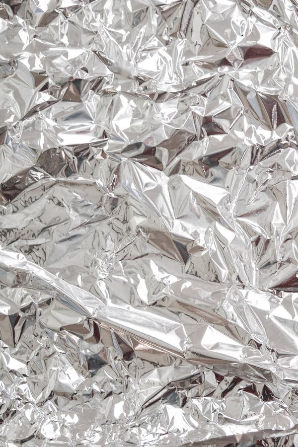 A Piece of Shiny Silver Foil with a Crumpled Texture Stock Photo ...