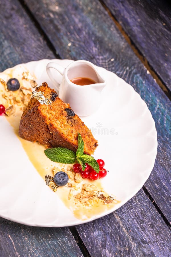 A Piece of Sponge Cake on a Plate. Dessert in the Restaurant Photo for ...