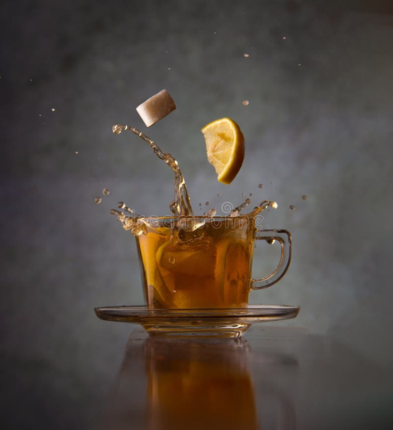A Piece of Sugar and a Slice of Lemon Fall into a Mug of Stock Photo ...