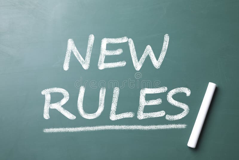 Piece of White Chalk and Text NEW RULES on Greenboard Stock Image ...