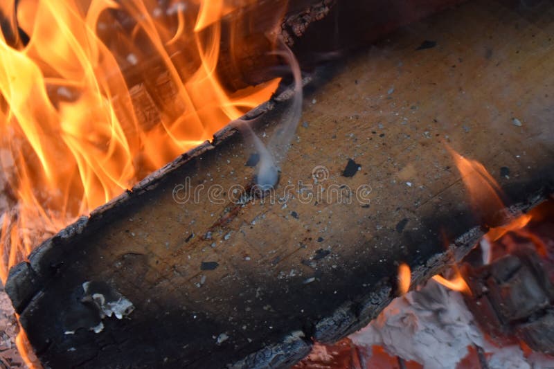 Piece of Wood with a Bright Red Flame in it Stock Image - Image of ...