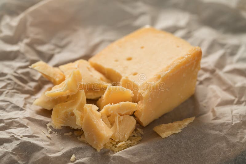 Pieces of Aged Hard Cheese on Paper Stock Photo - Image of vintage ...