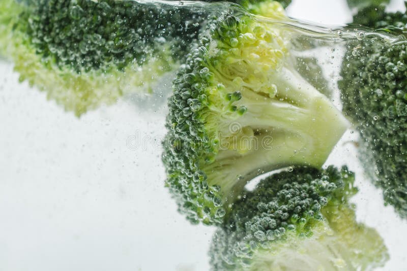 Pieces of Appetizing Broccoli in Clear Water. Stock Photo - Image of ...